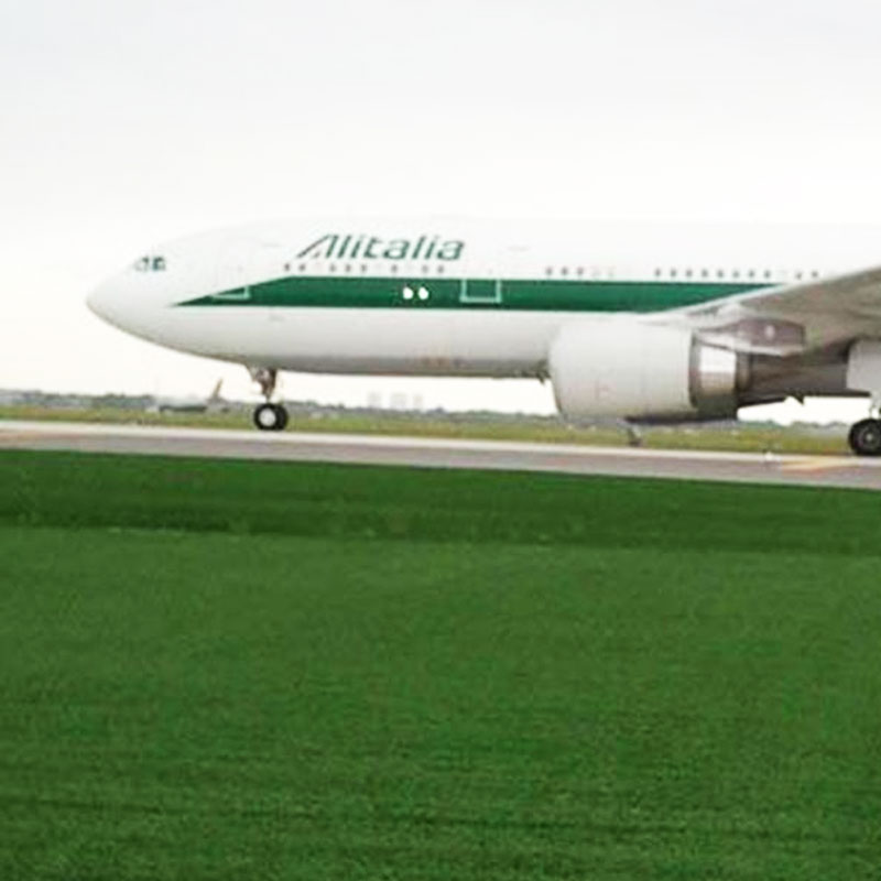 Green artificial turf around the airport runway