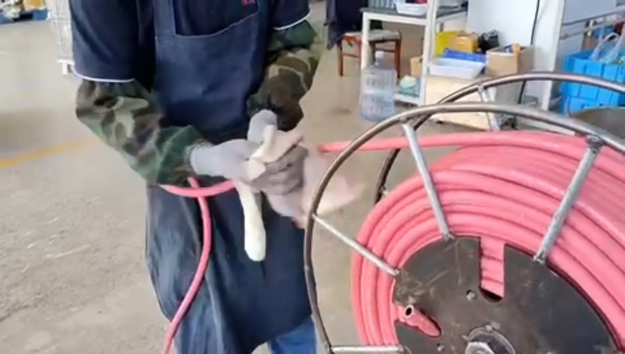 How do we roll up rubber hoses?